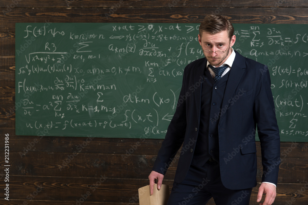 Exacting teacher. Teacher formal wear and glasses looks smart ...