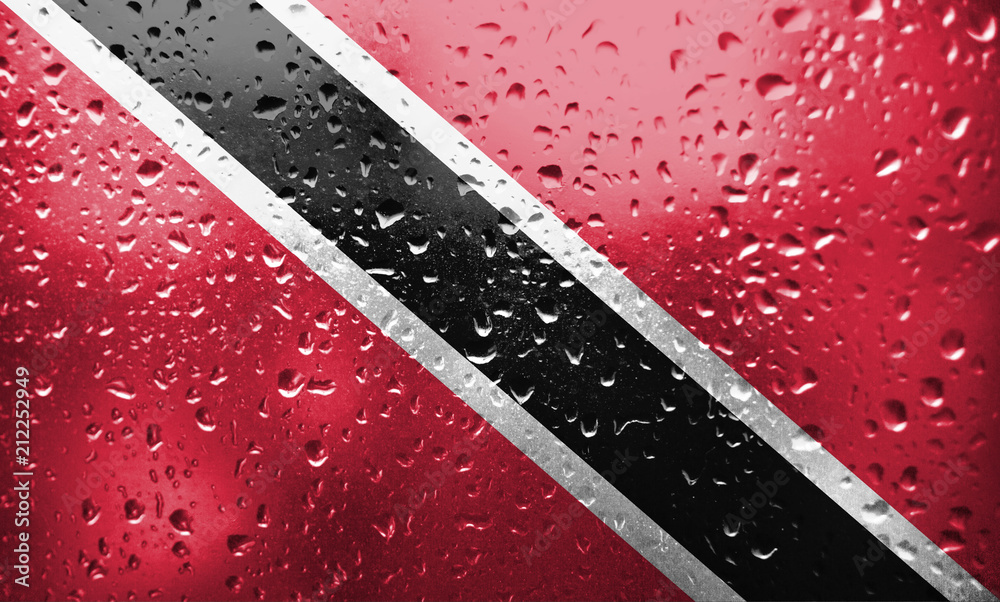 Texture of Trinidad and Tobago, flag on the glass with drops of rain ...