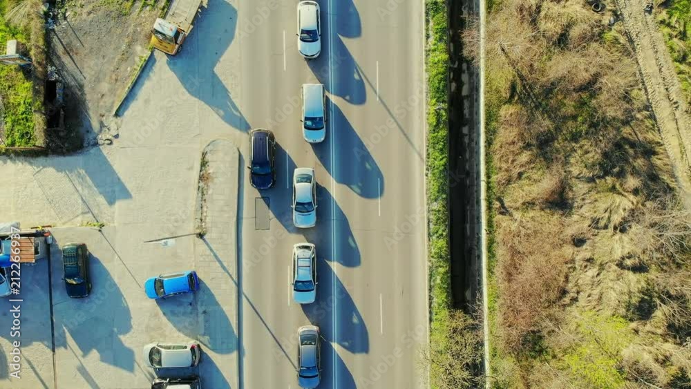 Panoramic aerial footage of a busy street traffic jam road. Vertical ...