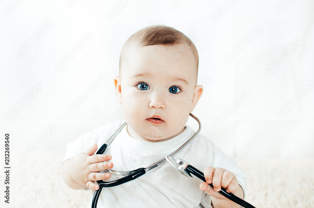baby in a diaper with a stethoscope Stock Photo | Adobe Stock
