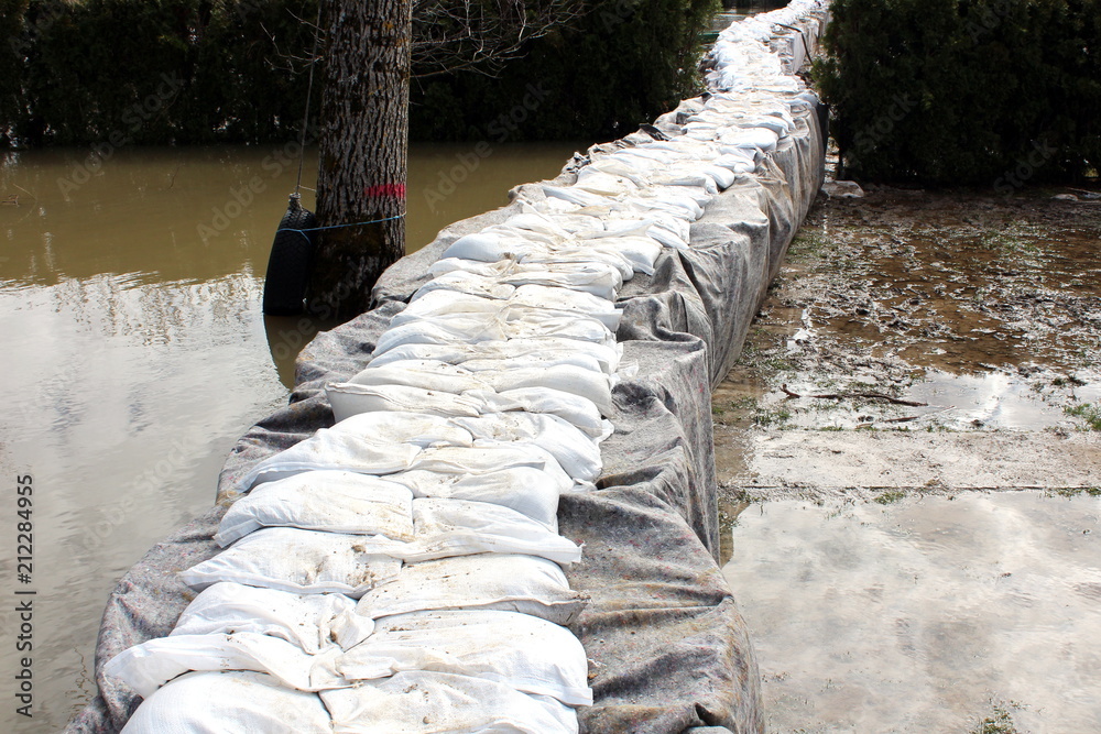 Sandbox barriers flood protection completely covered with geotextile ...