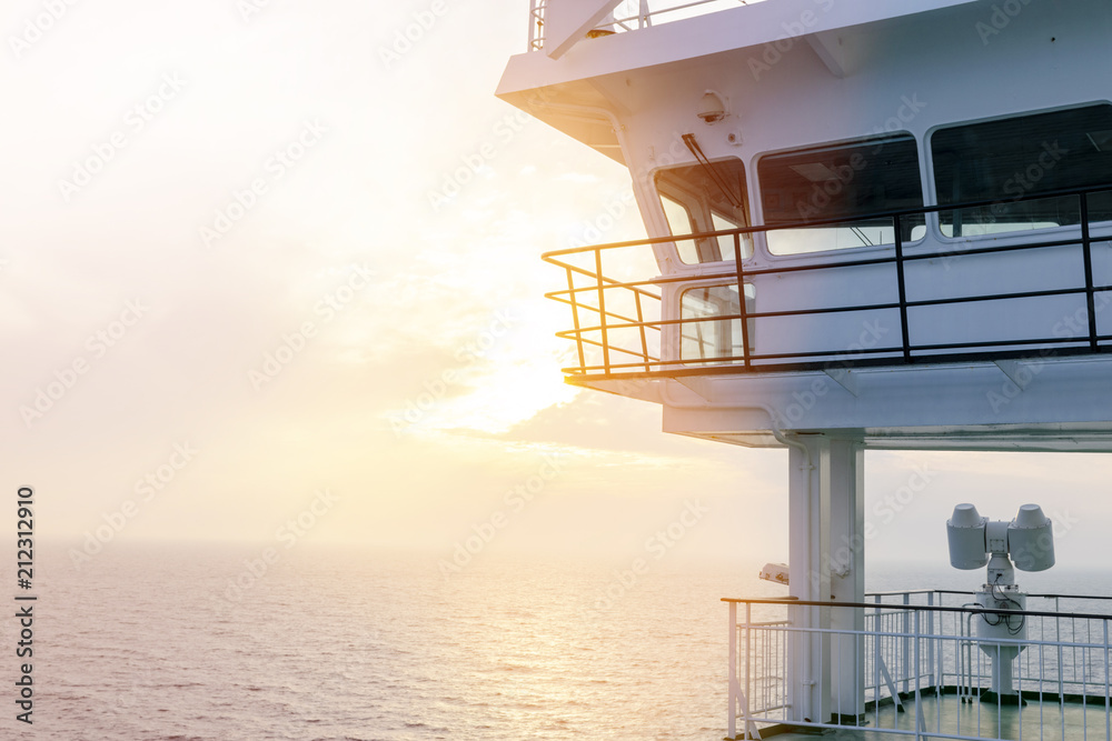 Cruise ship white cabin with big windows. Wing of running bridge of ...