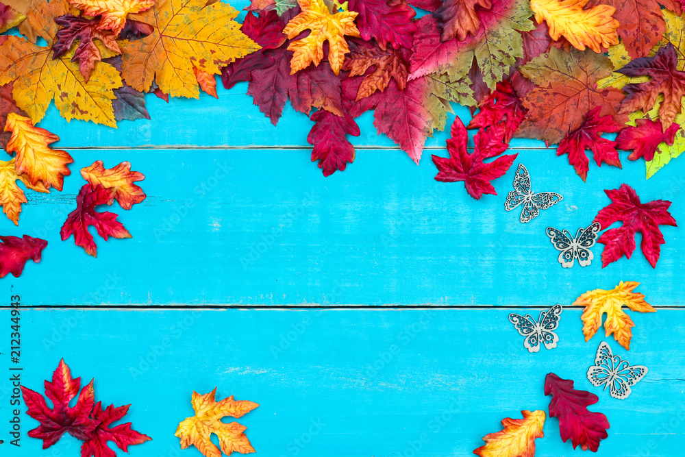 Blank antique rustic teal blue background with colorful autumn leaves ...