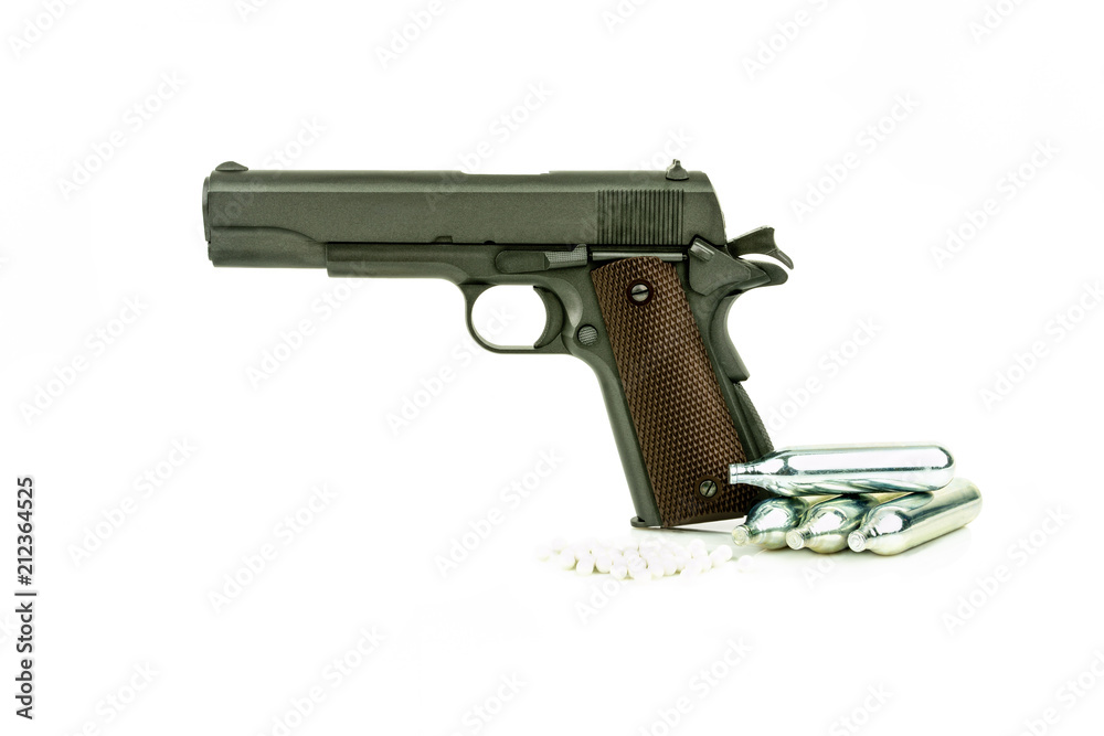 Profile view of isolated semi-automatic airsoft handgun with bullets ...