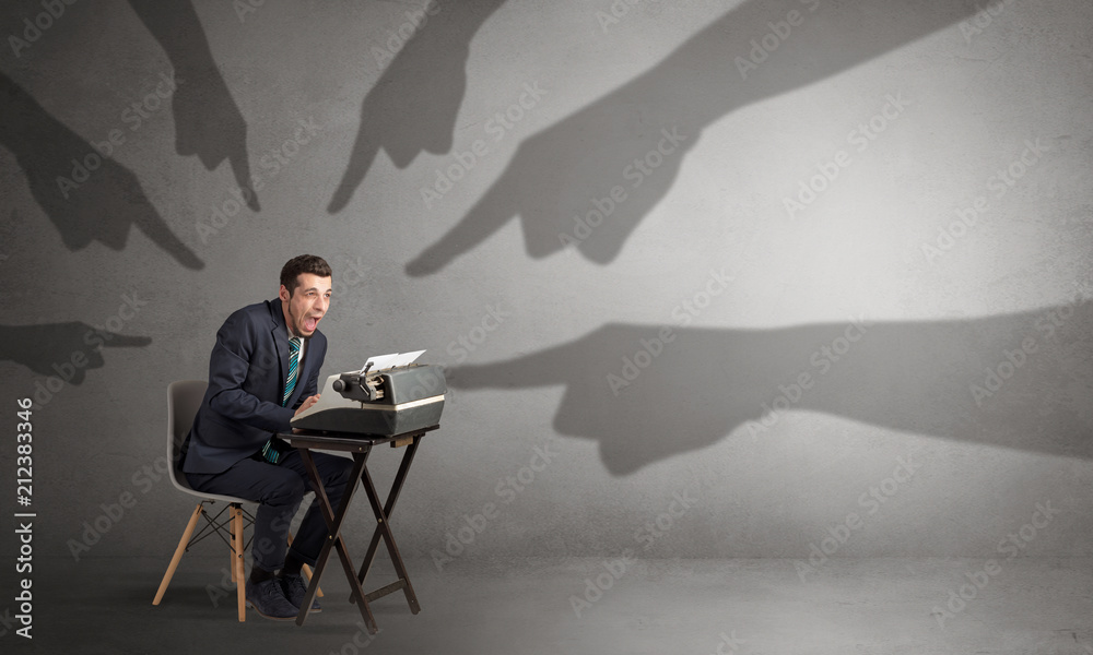 Shadow hand pointing at a small afraid worker Stock Photo | Adobe Stock