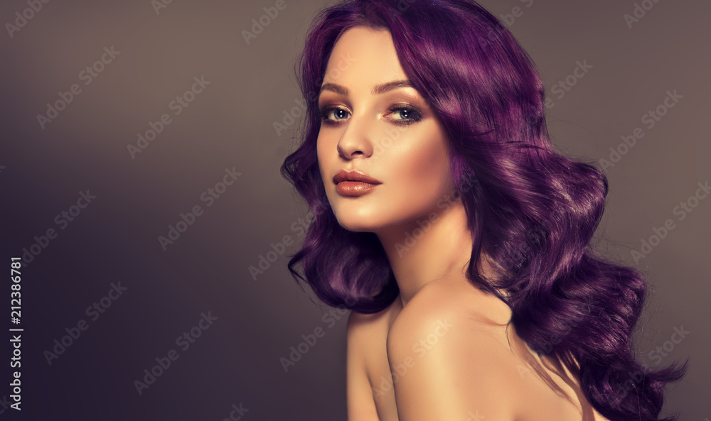 Beautiful model girl with long purple curly hair . Care products ,hair ...