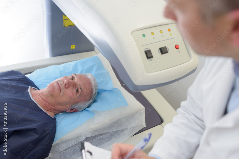 male patient ready to undergo mri assisted by doctor Stock Photo ...