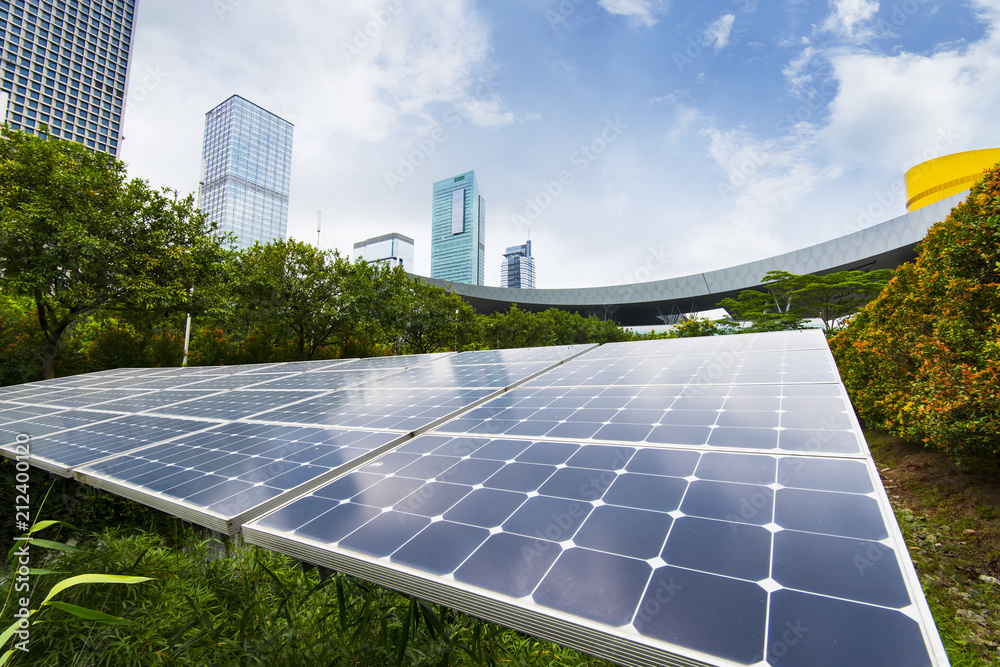 Ecological energy renewable solar panel plant with urban landscape ...