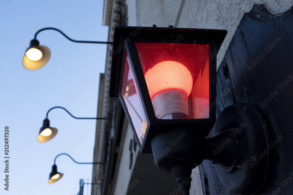 Red Light On The Wall With A Blue Sky And Yellow Bulbs Stock Photo ...