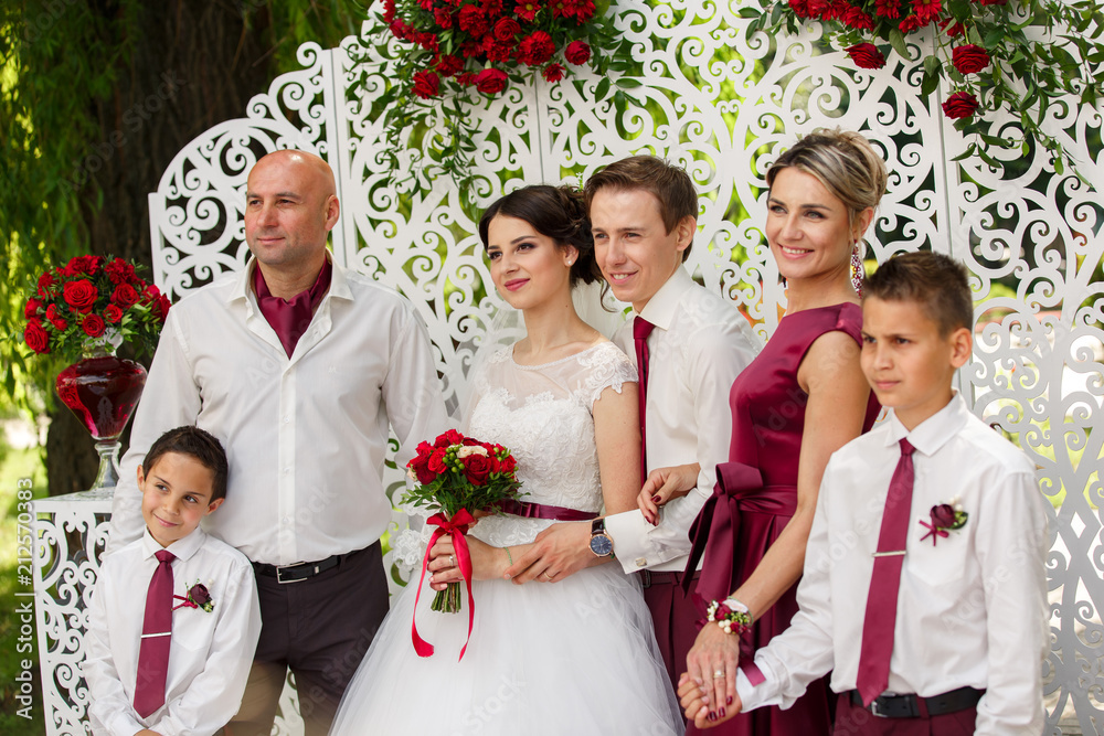 Happy wedding family photo after the ceremony, smiling bride and groom ...