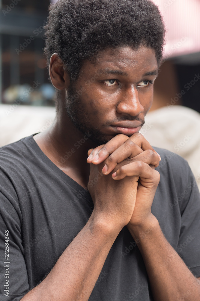 thoughtful african man thinking, planning; portrait of serious, worried ...