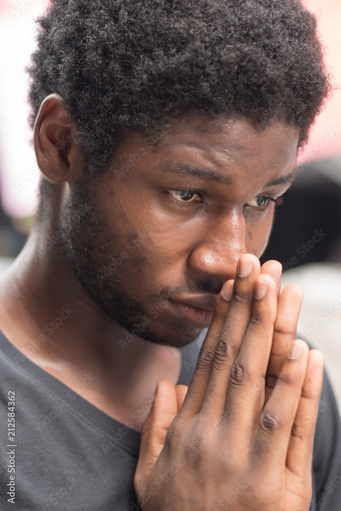 thoughtful african man thinking, planning; portrait of serious, worried ...