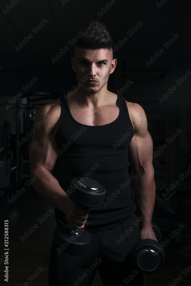 Bodybuilder with dumbbell Stock Photo | Adobe Stock