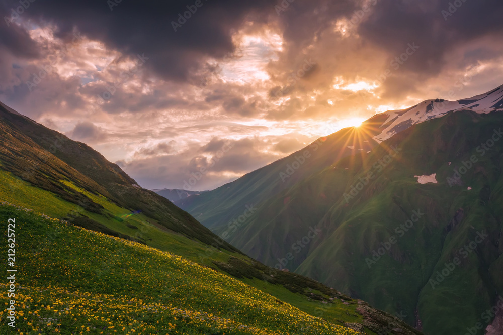 Amazing landscape of mountains and hills on sunset with colorful sky ...