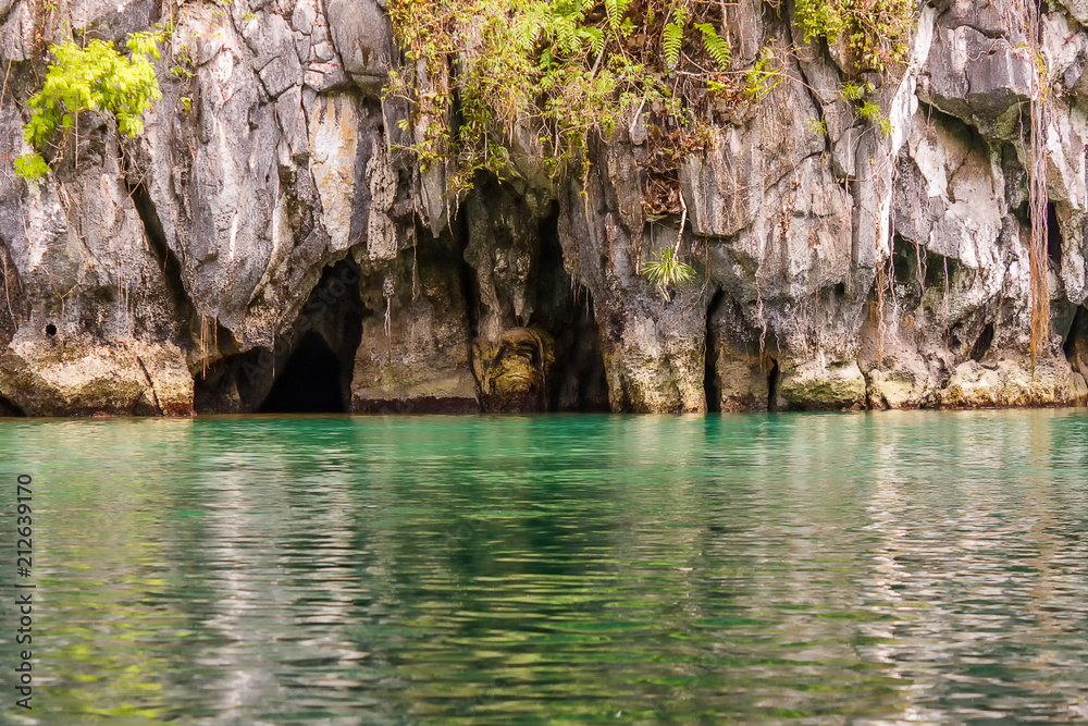 Entrance to the caves across the river. the island of Palawan. The ...