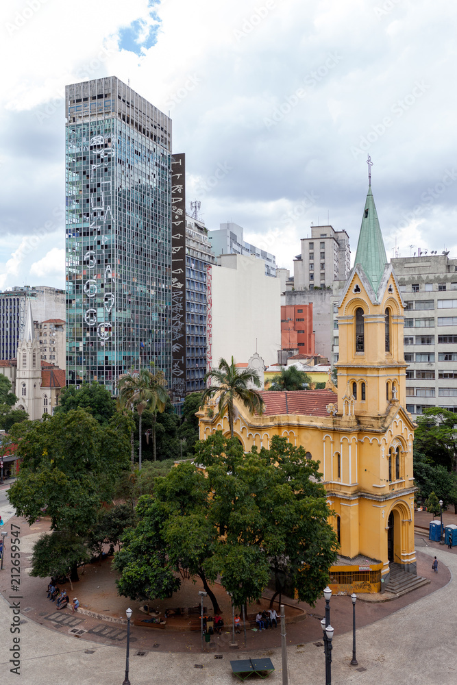 Square with old church and high rise squat building in the historic ...