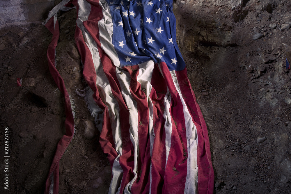 Symbolic Tattered and Torn American Flag on the Ground in Dirt Stock ...