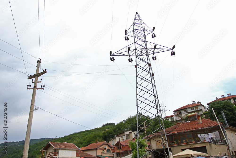 Electrical towers with wires for electricity in the center of the city ...