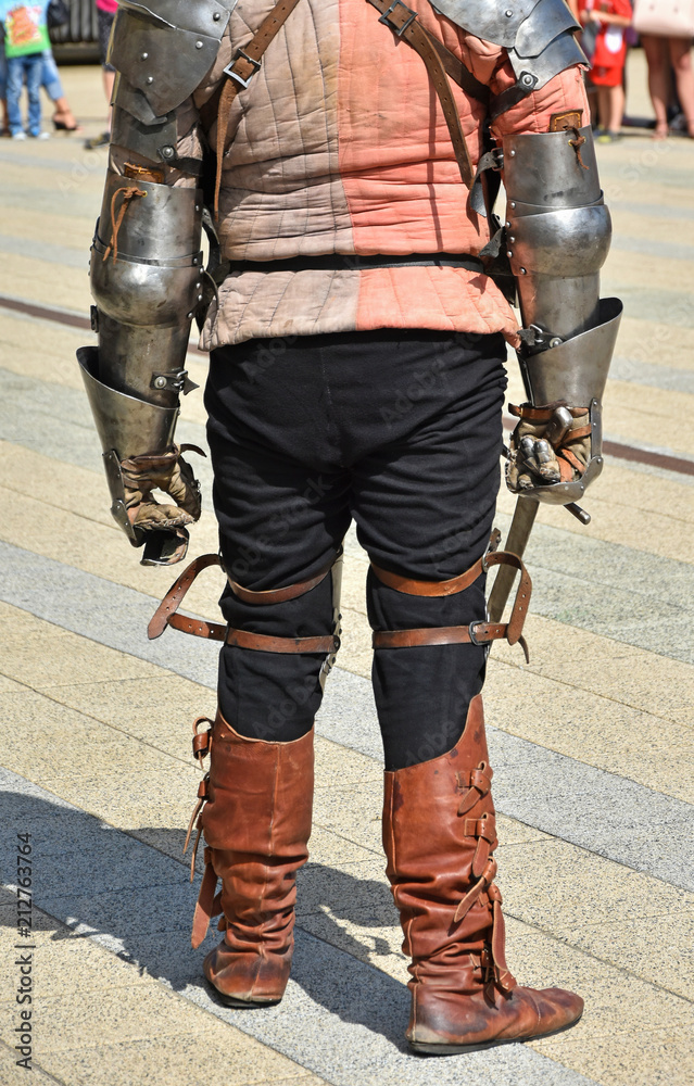 Armored knight with a sword ready to fight Stock Photo | Adobe Stock