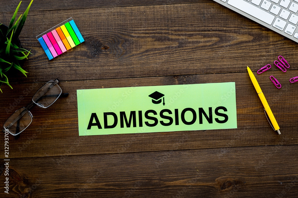 College admission concept. Word admissions with graduation cap sign on ...