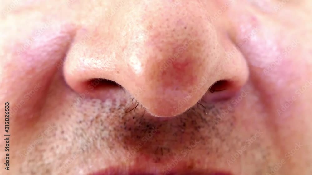 a human nose, an angry person, breathing from the nose, Stock Video ...
