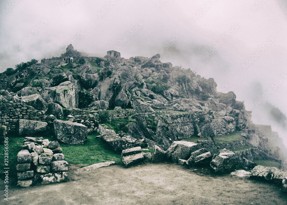 Stone magical ancient ruins along the paved path Inca Trail to Machu ...