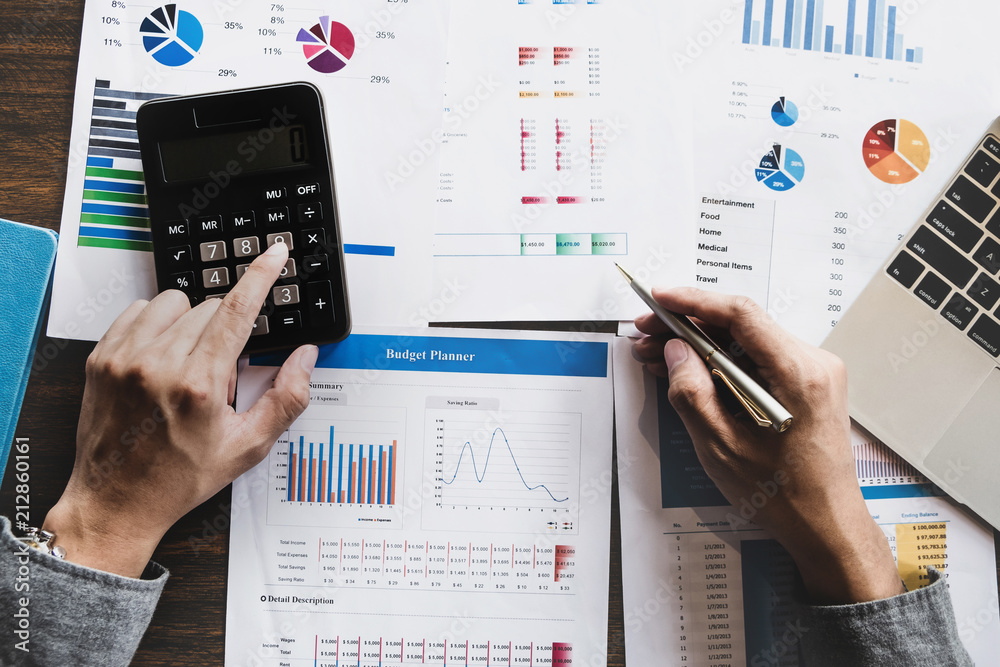 Bookkeeper accounting, Male use pen and calculator to monitor money saving reports budget to ...