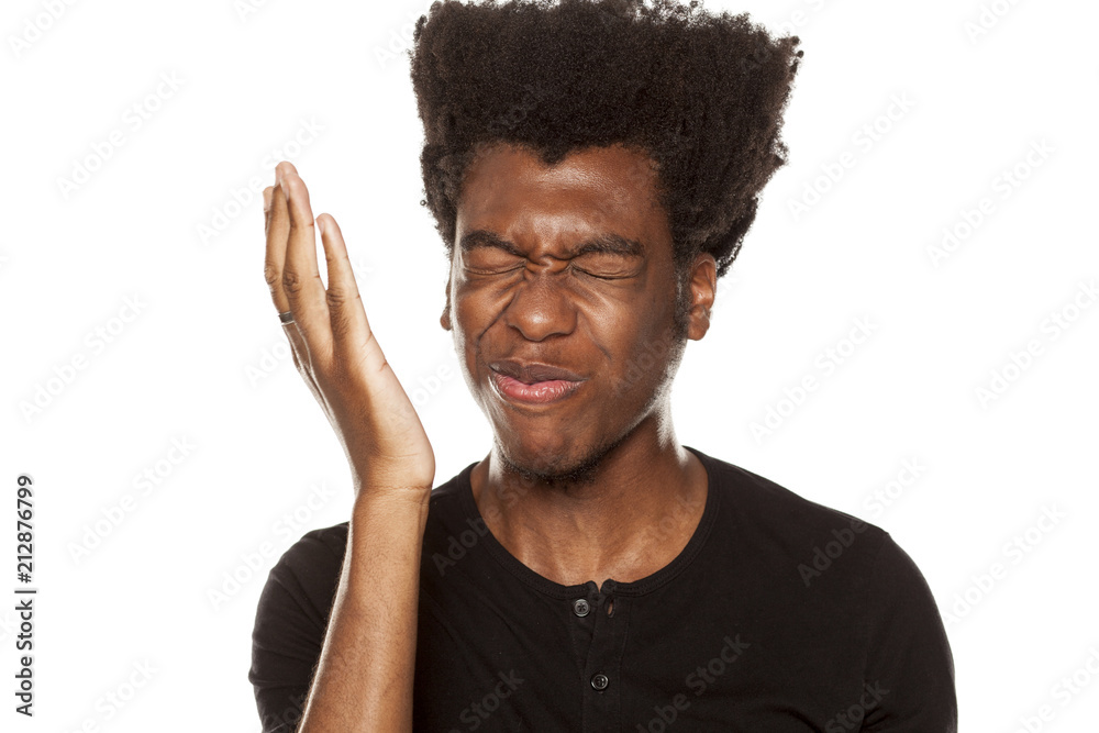 Portrait of young worried african american modern man slapped himself ...