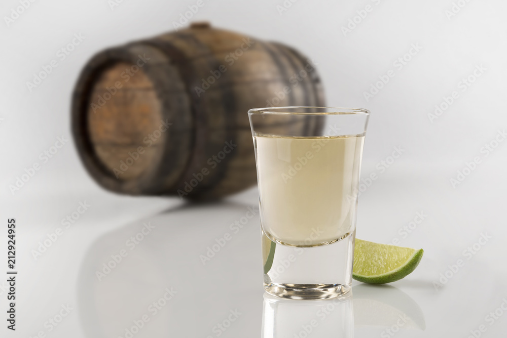 Authentic shot of Tequila with blurred barrel on background Mexican ...
