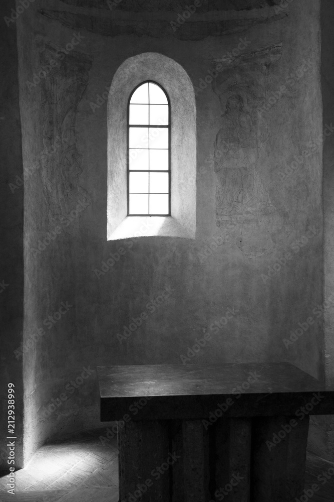 Ancient thick walled monastery / church window niche with wooden bench ...