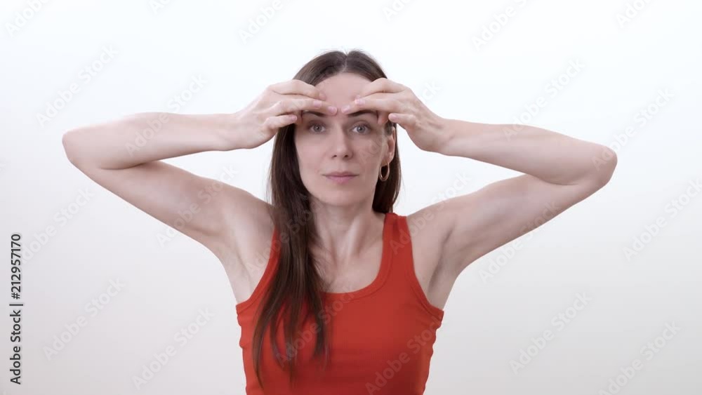 Portrait of brunette woman doing horizontal movement of fingers over ...