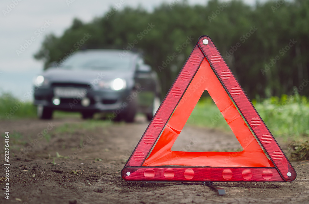 Car breakdown Not enough fuel. Red emergency triangle stop sign and car ...
