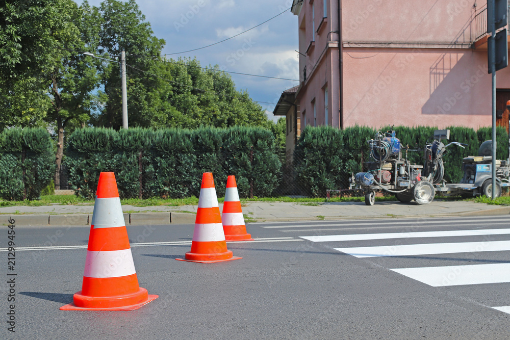 Marking with traffic signs a new colored pedestrian crossing ...