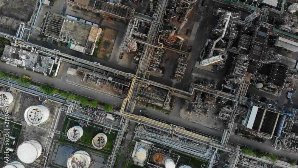 Aerial top down view over oil refinery or chemical factory and power ...