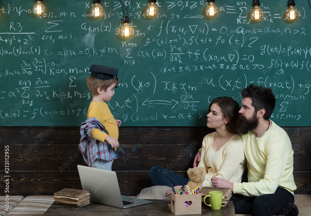 Learning at home. Little child learning at home with parents. Learning ...