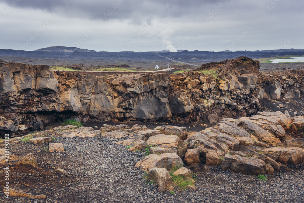 Rocks next to symbolic footbridge between two continents in Reykjanes ...