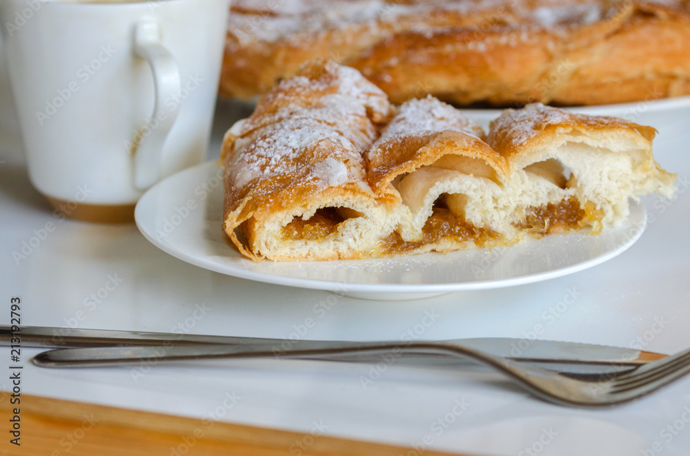 Ensaimada and cup of coffee. Ensaimada is traditional pastry in ...