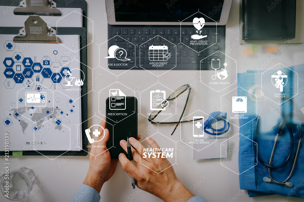 top view of smart medical doctor working with mobile phone and laptop ...