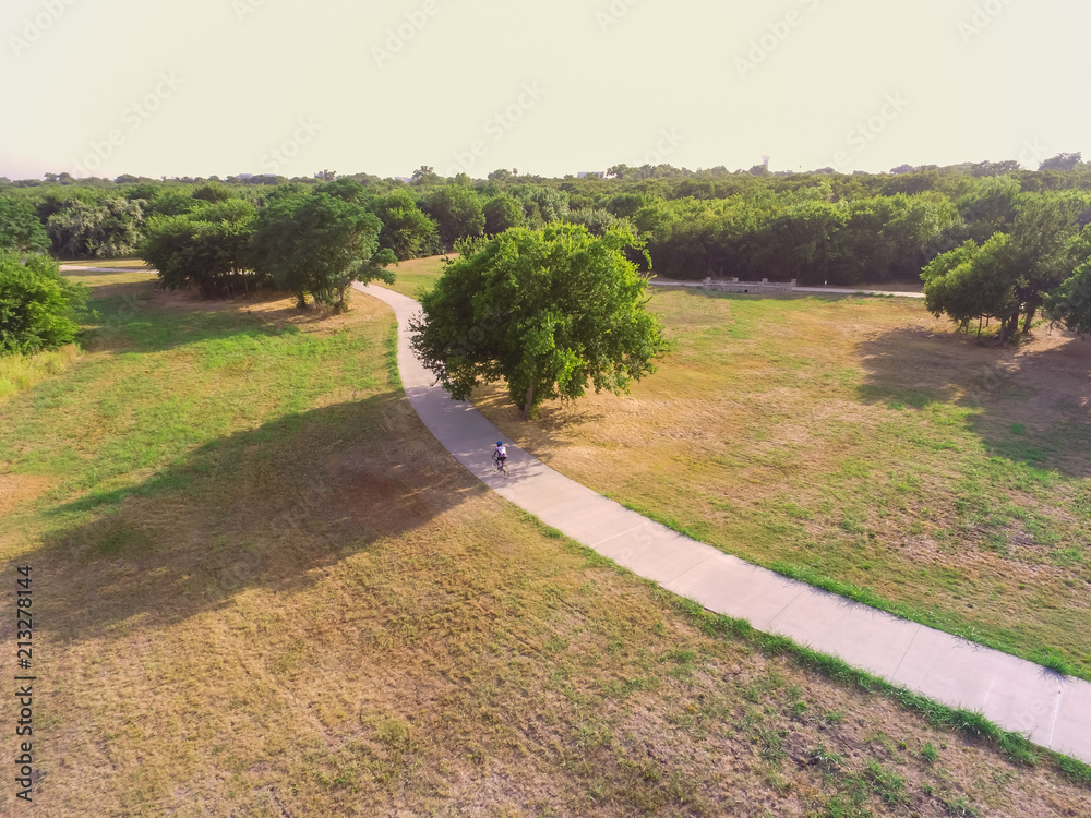 Top view park paved pathway with biker riding bike in Irving, Texas ...