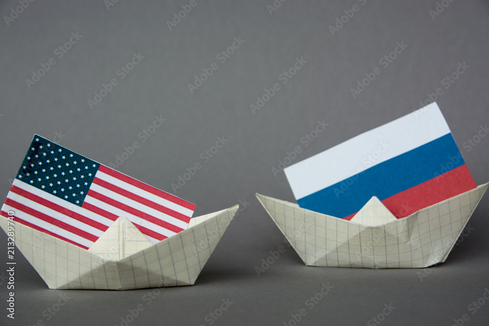 paper ship with Flags of USA and Russia. conflict concept shipment or ...