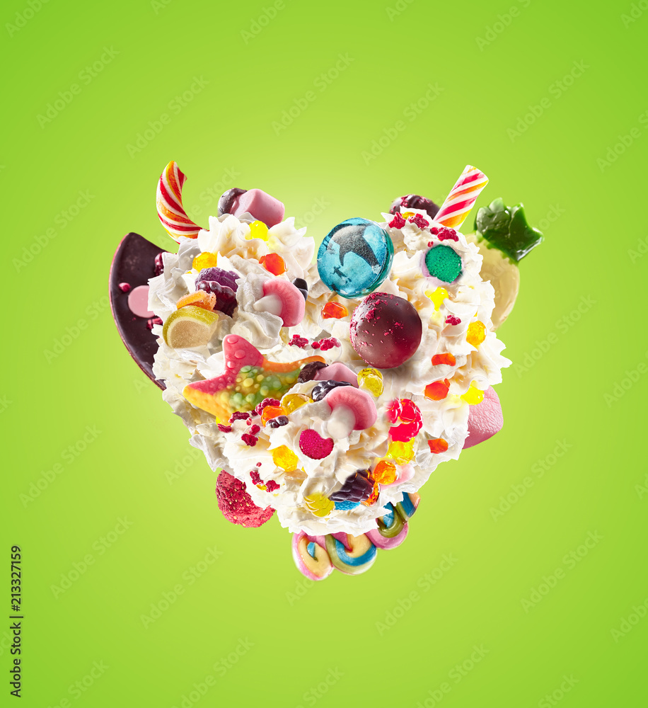 Heart form from whipped cream with sweets, jellies, heart front view ...