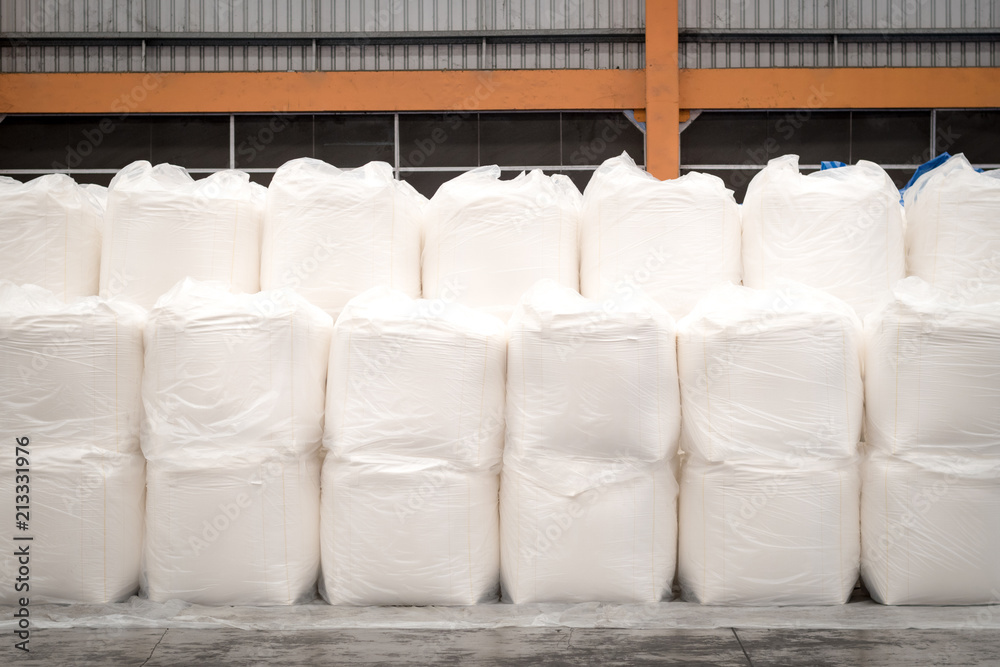 Big white jumbo bag of sugar stacking in warehouse ready for export ...