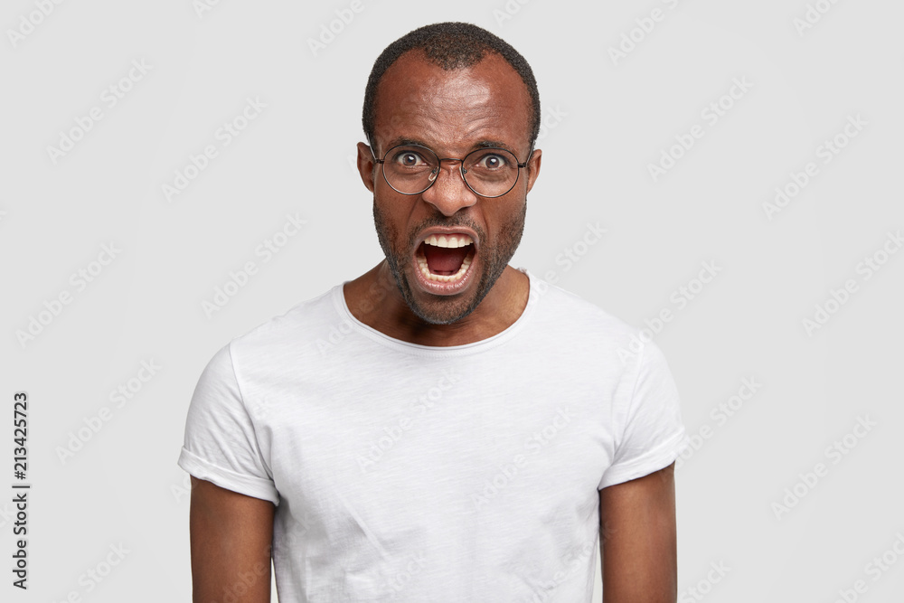 Negative human reaction concept. Angry furious young African American ...