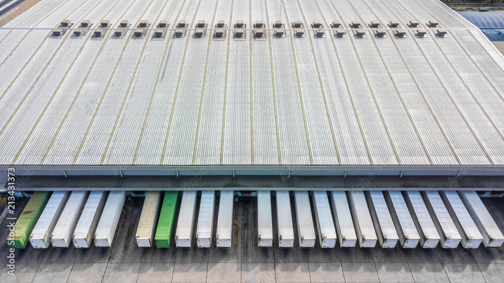 Aerial top view of truck and cargo trailer unloading in logostics ...