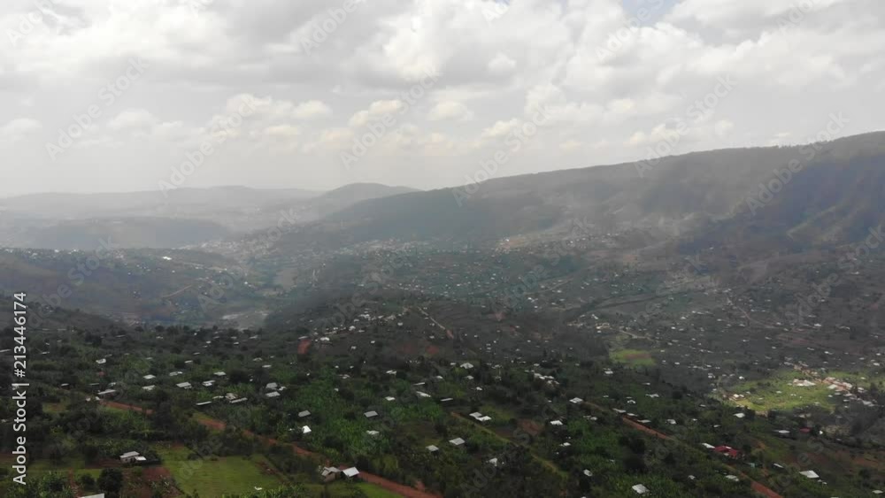 Aerial drone footage of a village in Rwanda. Gorgeous green hills and ...
