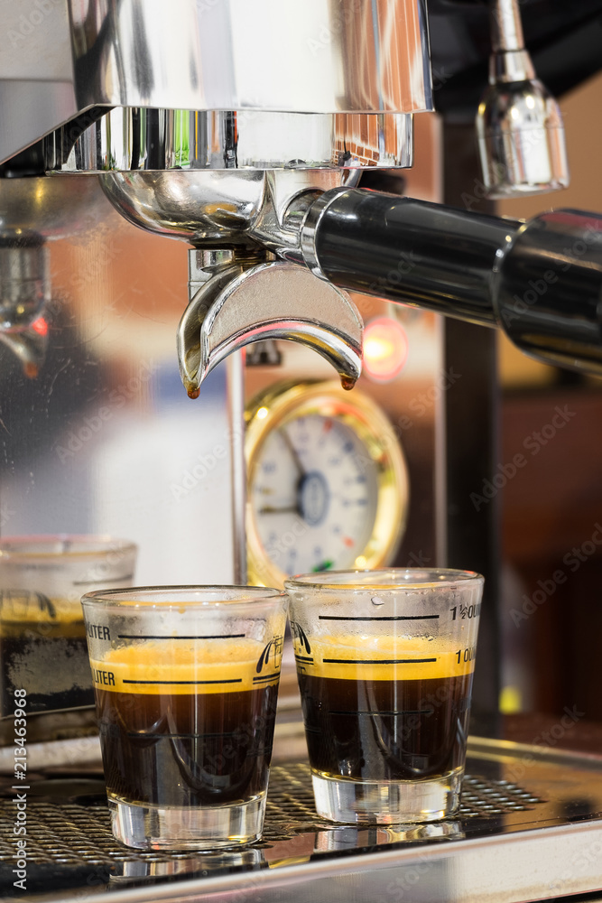 Double shot coffee pouring from Espresso machine. Perfect brewing ...