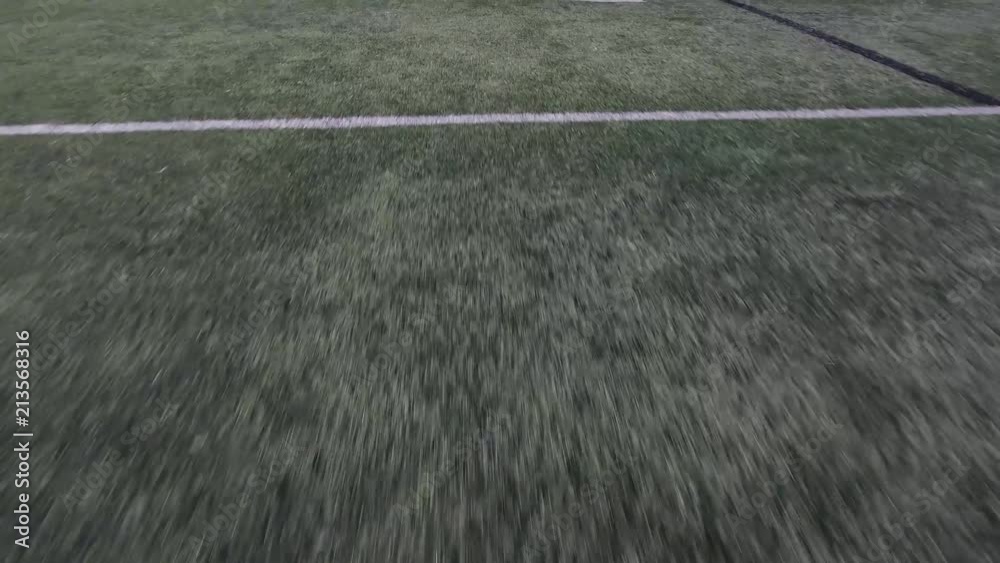 Flyover veiw of football field yardlines Stock Video | Adobe Stock