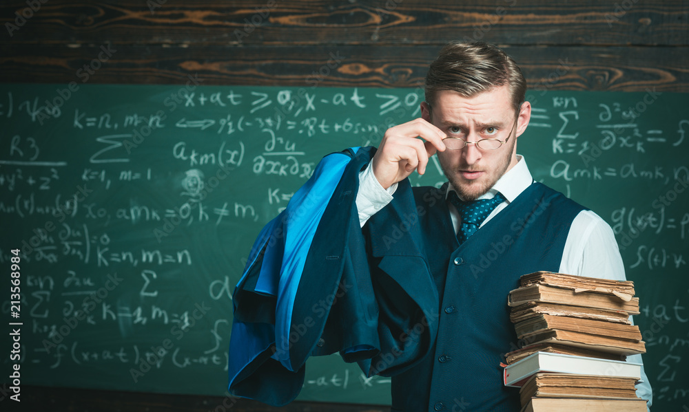 Check homework. Teacher formal wear and glasses looks smart, chalkboard ...