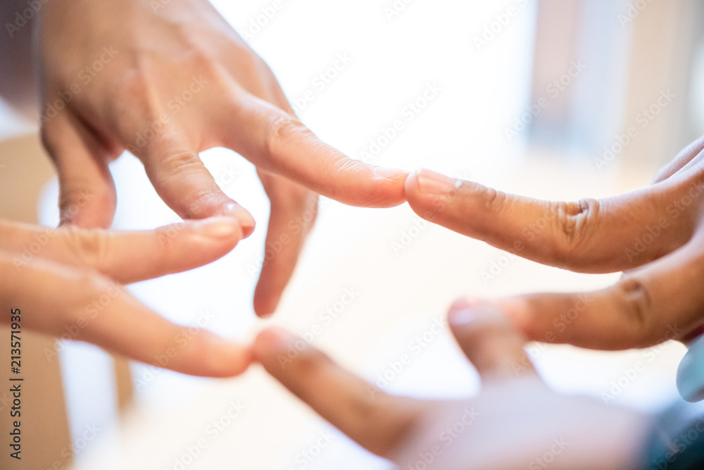 Foto de startup standing finger sign together.business people joining ...