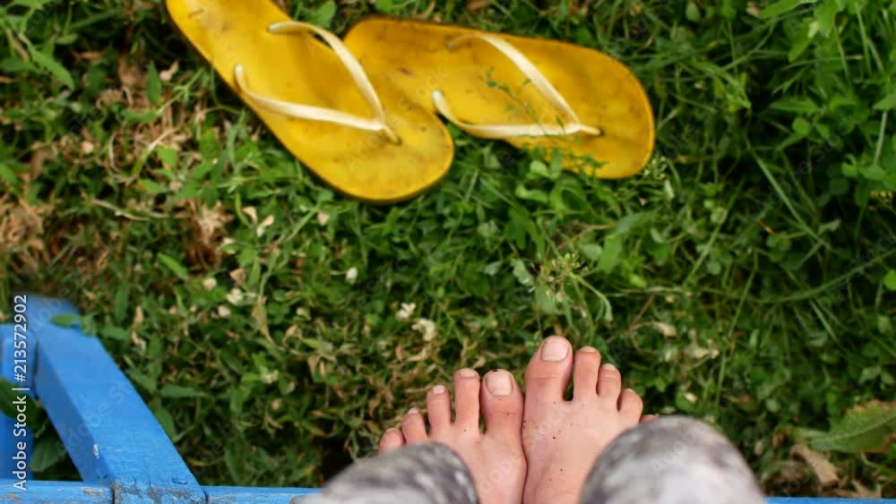 Woman feet barefoot on spring soil, long skirt in wind breeze. Stock ...